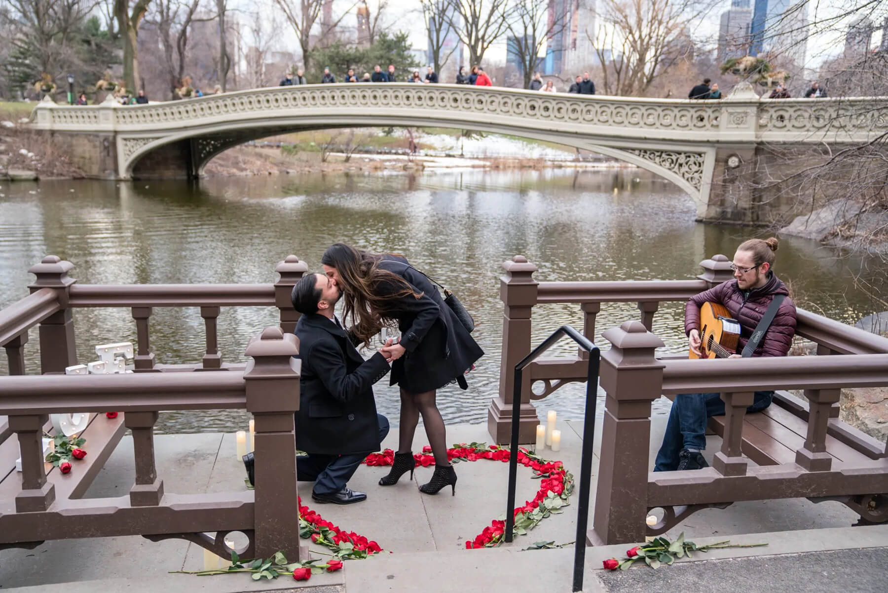 Romantic Proposal By the Bow Bridge with Musician and Rose Heart ...