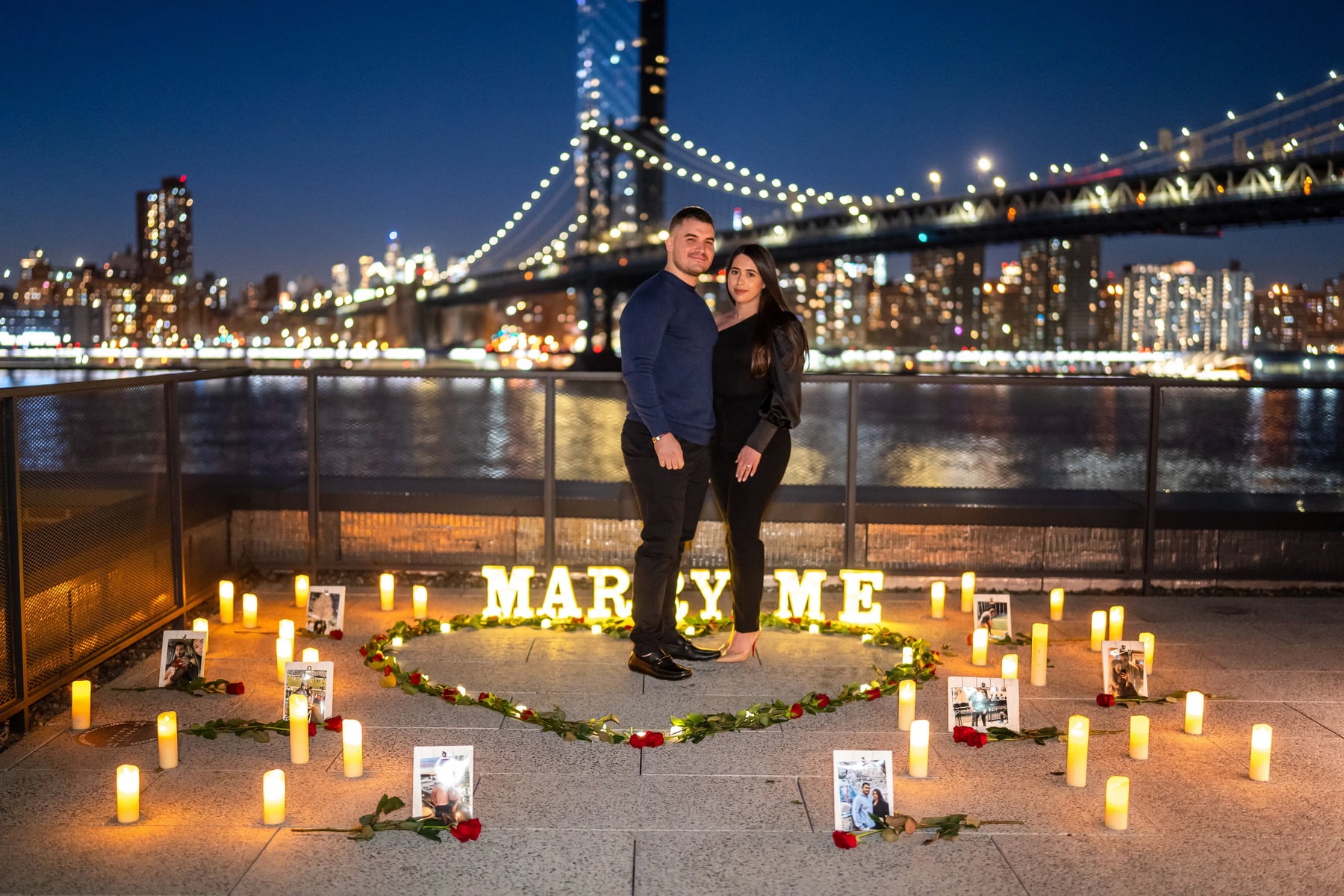 Candlelight proposal with the Brooklyn Bridge on the background ...